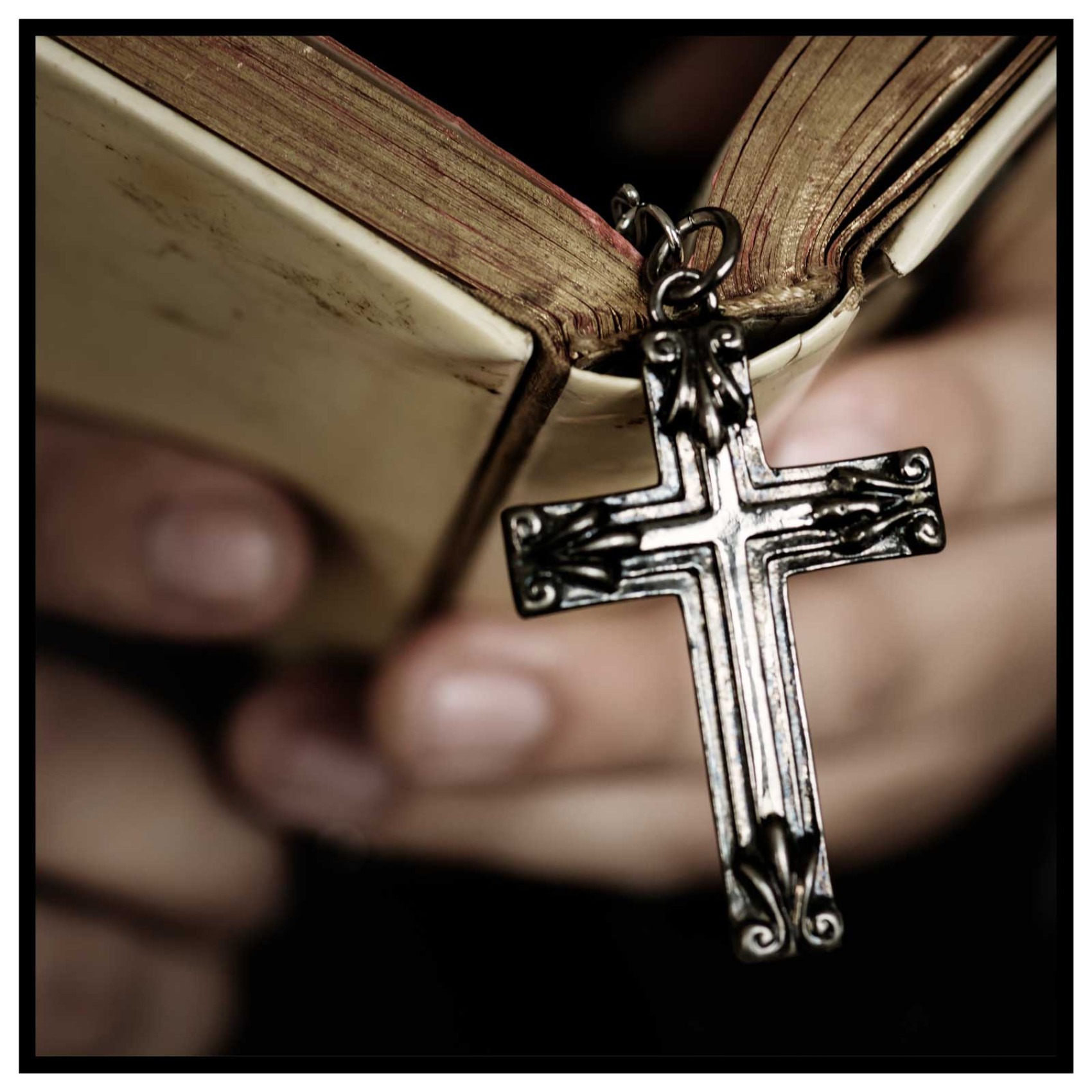 Holy book & cross in hands poster